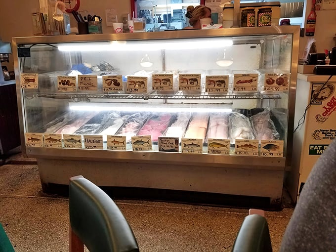 The market counter reveals the restaurant's secret weapon—seafood so fresh it practically introduces itself. "Hi, I'm dinner, nice to meet you!"