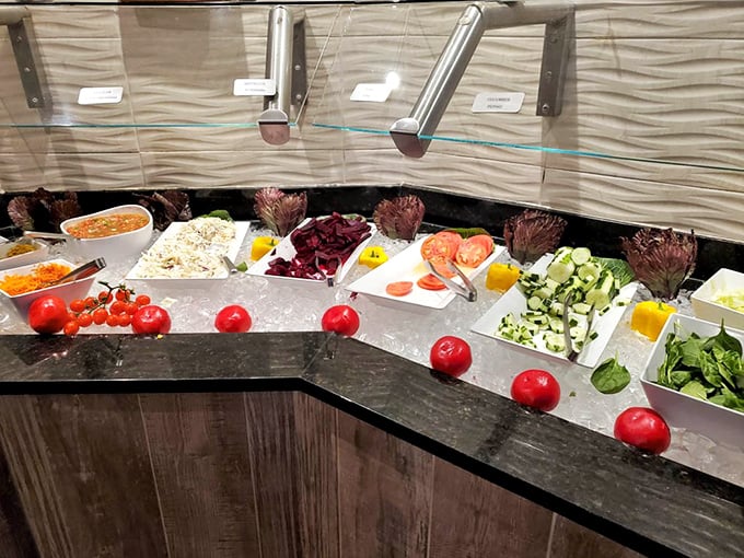 Fresh vegetables, crisp greens, and colorful salads line the self-service counter—the smart diner's first tactical move before the meat parade begins.