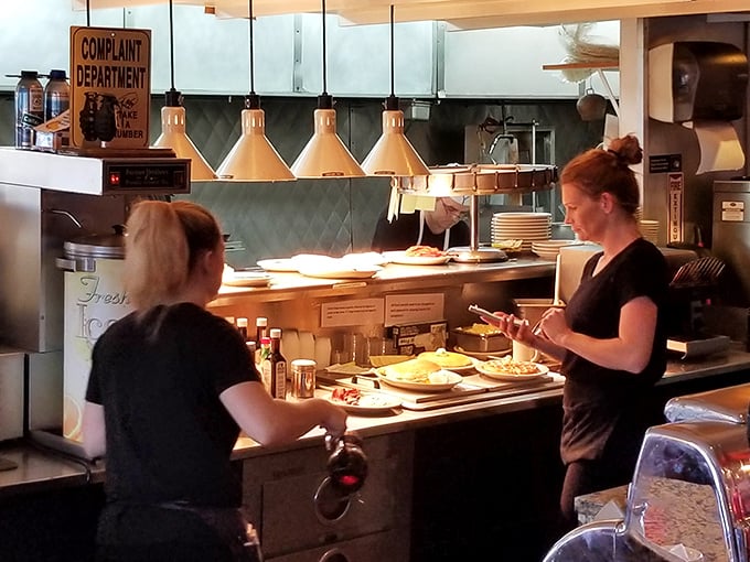 The "Complaint Department" sign says it all—kitchen humor that's been making customers smile longer than most food trends have existed.