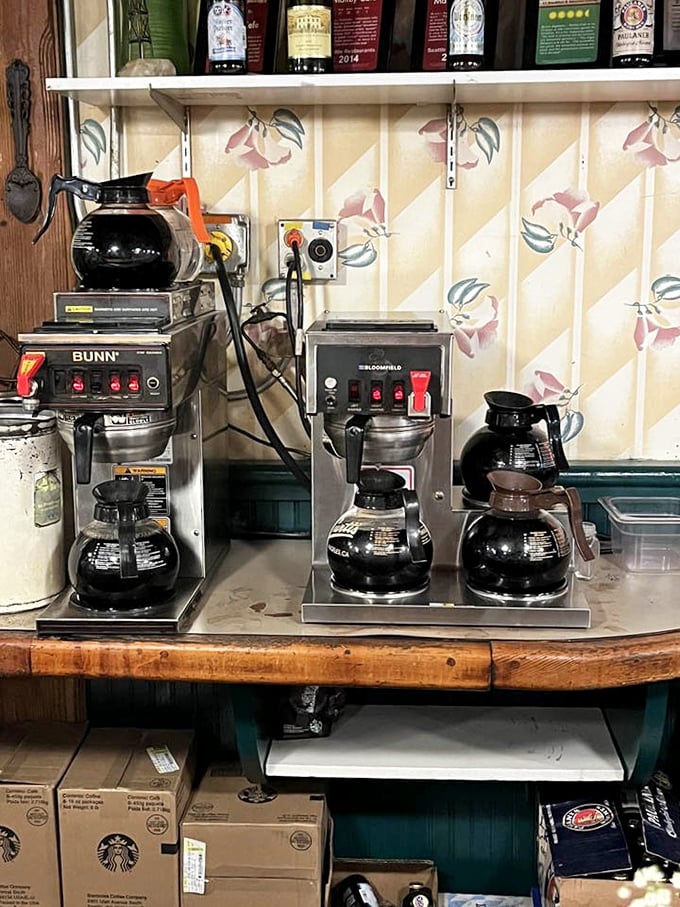 Multiple coffee pots lined up like soldiers ready for battle—because great breakfast starts with serious caffeine reinforcements, no exceptions here.