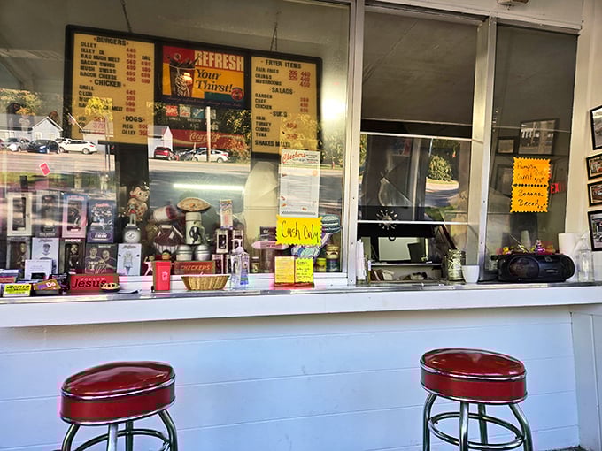 Red bar stools and a counter filled with memorabilia—each trinket tells a story, each menu item promises satisfaction.