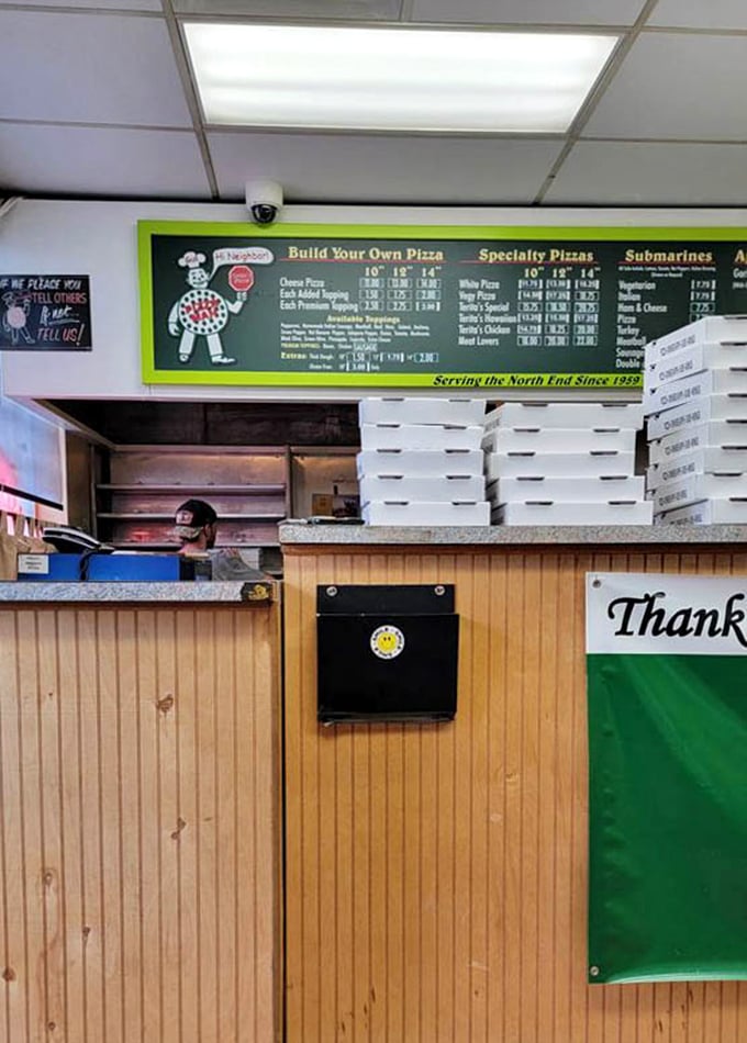 Behind this counter, pizza artisans have been crafting Columbus memories for generations. No fancy wood-fired ovens—just consistent excellence.