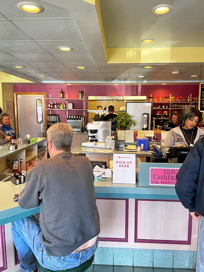 The counter—that magical divide where coffee appears, orders materialize, and friendly banter flows as freely as the maple syrup.