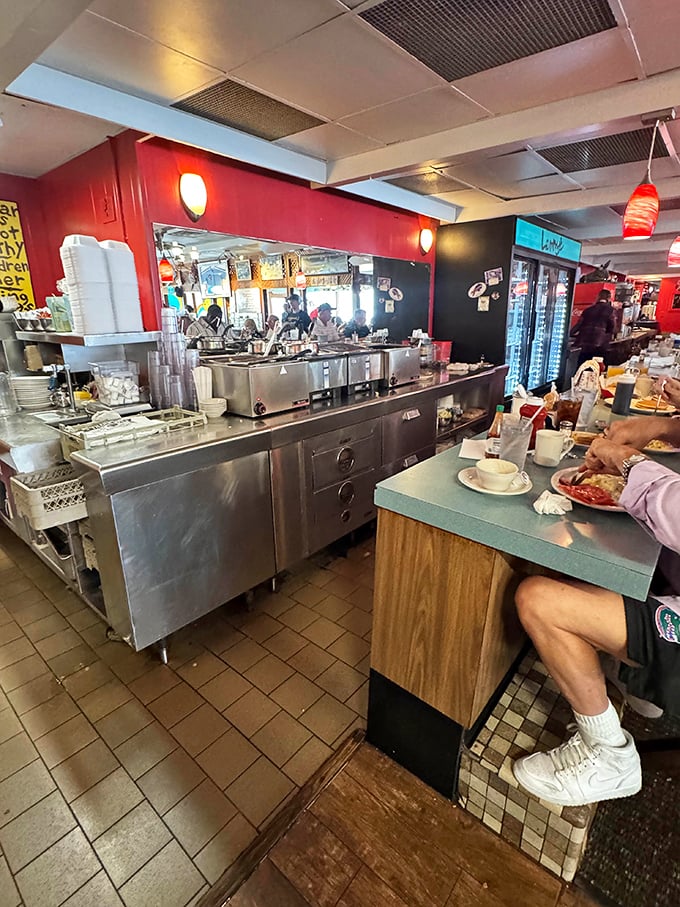 The bustling kitchen counter – where breakfast magic happens at lightning speed and servers perform their coffee-pouring ballet.