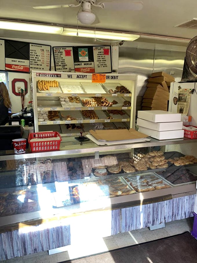 The service counter at Donut World operates with the precision of a Swiss watch and the warmth of your grandmother's kitchen.
