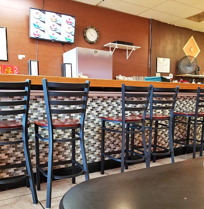 The counter's mosaic tile front adds a touch of style to this utilitarian space. It's where the magic happens—orders in, deliciousness out.