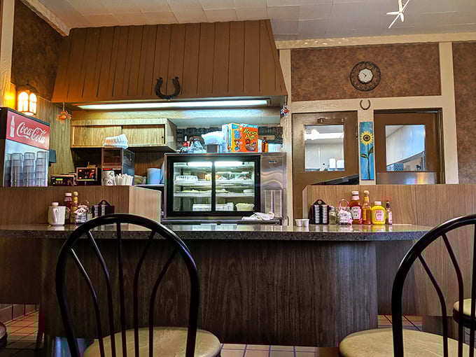 Behind this counter, breakfast dreams come true—where coffee flows freely and the short-order magic happens without pretense or fanfare.