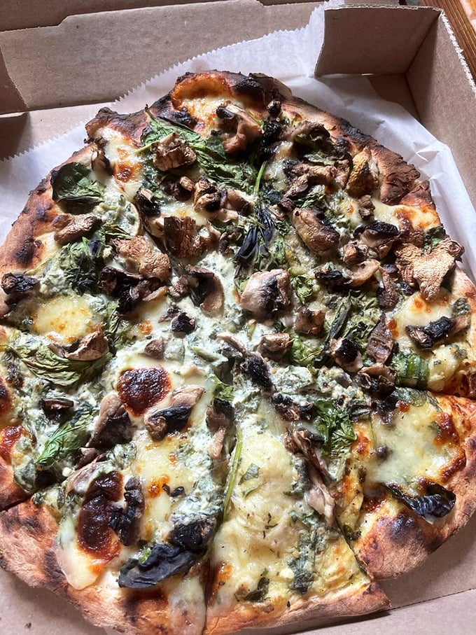 This mushroom and spinach pizza isn't just vegetarian—it's a fungi festival where earthy mushrooms and vibrant greens throw the party of the year.