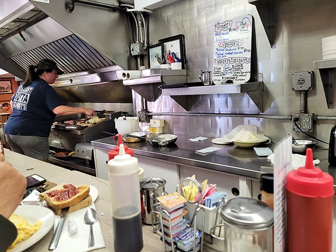 The kitchen ballet—where breakfast choreography has been perfected through thousands of morning performances.