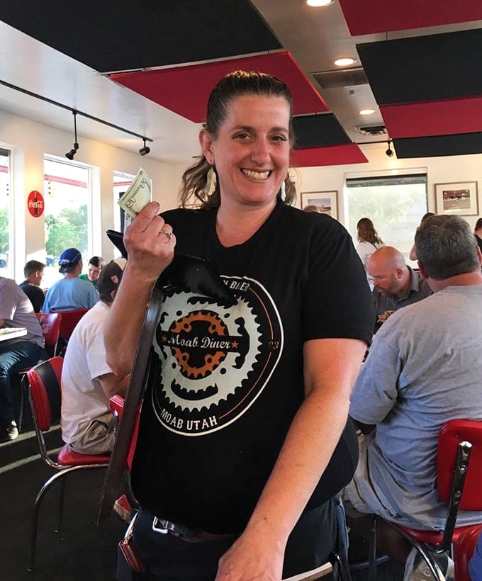 The servers here don't just bring food—they bring personality. That smile says, "Trust me, you're about to have the best meal of your vacation."