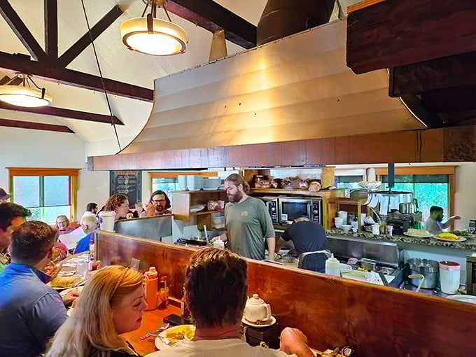 The open kitchen concept lets you witness breakfast alchemy in action. These culinary wizards move with the choreographed precision of a well-rehearsed dance troupe.