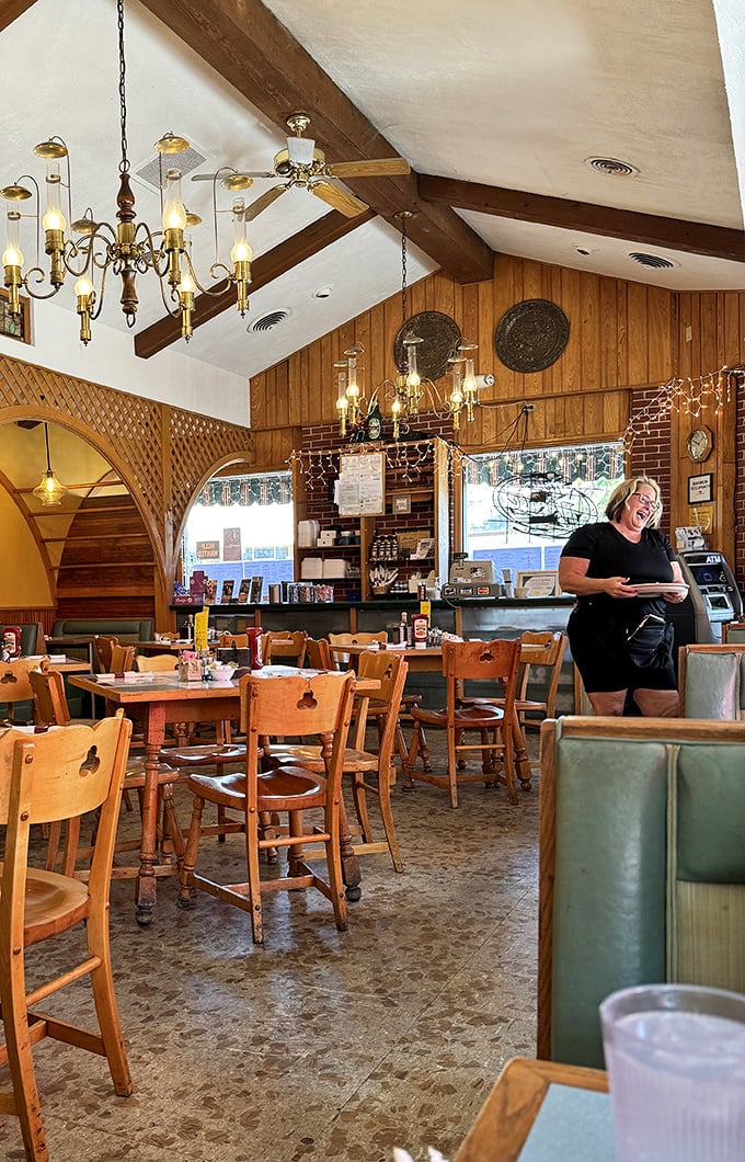 Where the magic happens – Lake Aire's dining room combines wood paneling, exposed brick, and the promise of plates arriving soon.