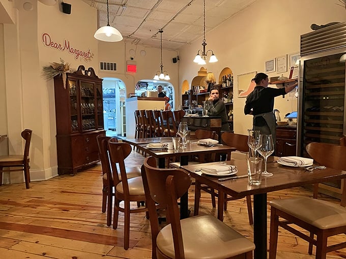 The open kitchen and visible staff remind you that real people are crafting each dish with care, skill, and genuine passion.
