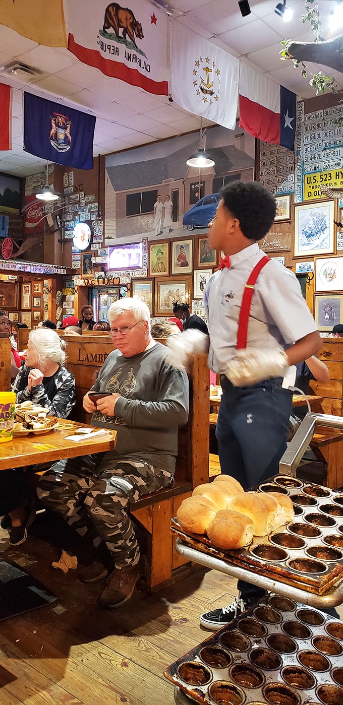 The servers at Lambert's don't just deliver food—they're bread-tossing athletes in suspenders, carrying on a tradition that defies modern restaurant norms.