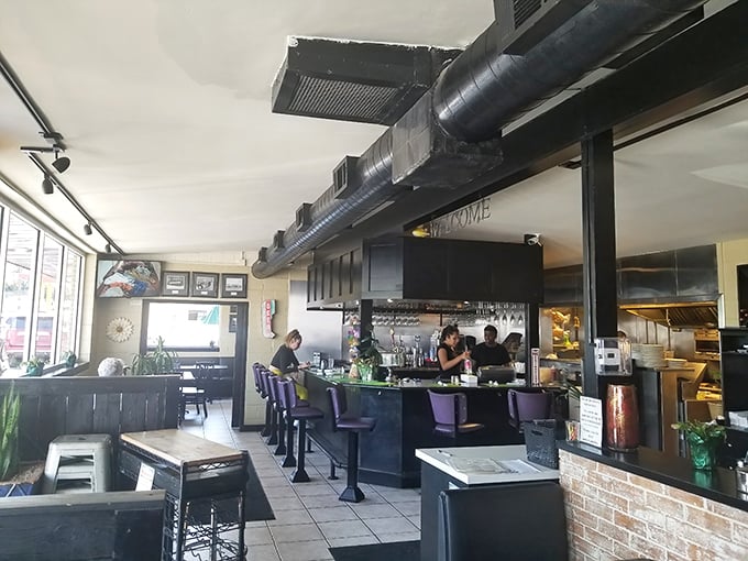 The open layout lets you watch your food's journey from kitchen to table – culinary theater with the best possible ending.