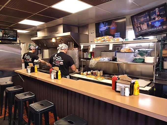 The kitchen crew moves with the precision of a Swiss watch, if Swiss watches made mouthwatering steamed cheeseburgers.