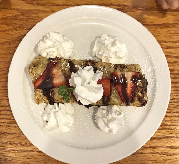 Strawberry plantain crepe drizzled with chocolate and crowned with whipped cream—breakfast just got fancy without being pretentious about it.