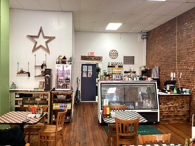 Exposed brick walls and checkerboard tables create the perfect backdrop for coffee conversations that somehow always taste better in small-town cafés.
