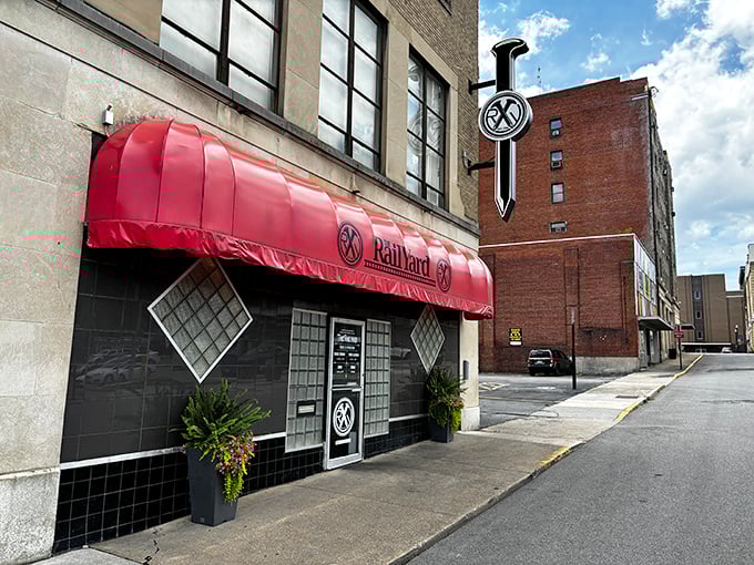 The RailYard's distinctive red awning signals a dining experience that proves good taste doesn't require emptying your savings account.