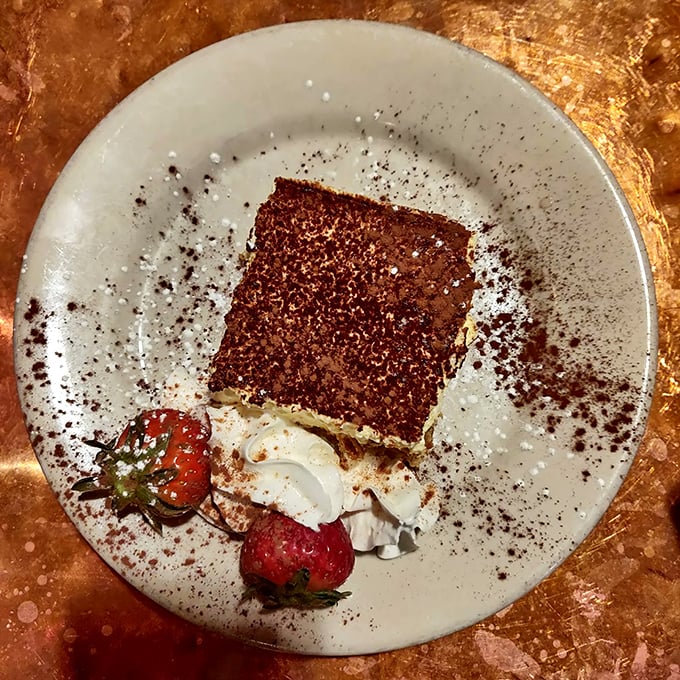 Tiramisu dusted with cocoa, looking like a delicious secret someone's about to share with you.