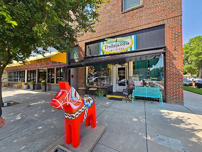 Trollslända Toy Store stands guard with its bright red Dala horse – because Swedish childhood magic deserves its own Main Street ambassador.