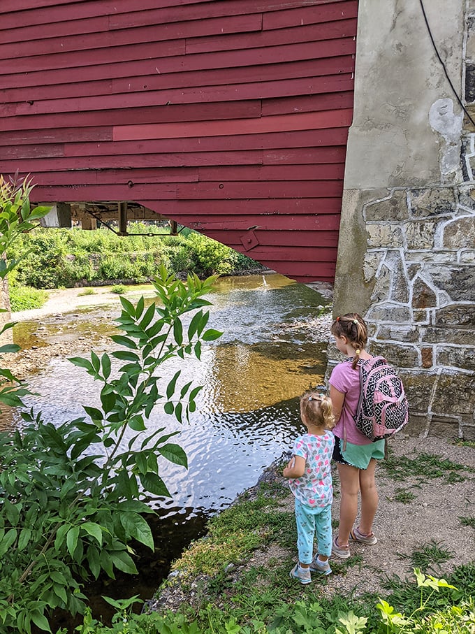 Peek beneath the bridge's skirts to see where Jordan Creek flows, offering cool respite for kids with rolled-up pants on hot summer days.