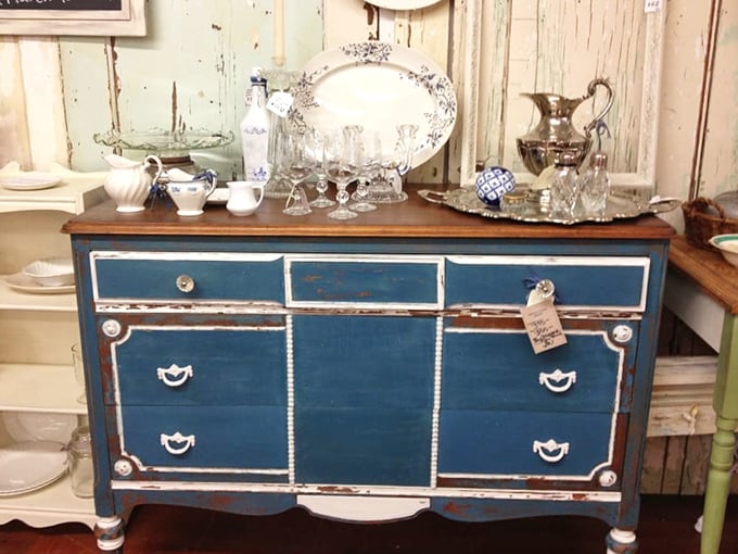 This distressed blue dresser isn't just furniture—it's a statement piece that says "I have excellent taste and know where the good stuff is."