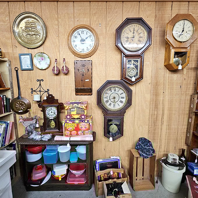 A wall where time literally stands still – vintage clocks frozen at different moments, waiting for someone to wind them back to life.