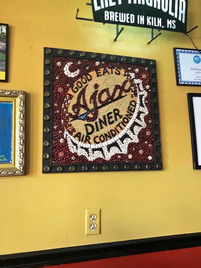 The bottle cap art on the wall isn't just decoration – it's a shrine to good times had and good times coming. Pure Oxford magic.