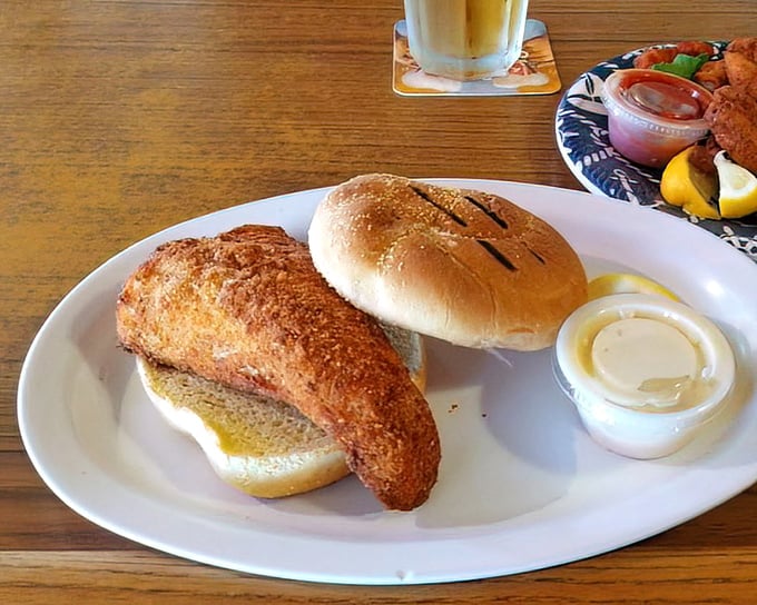 The walleye sandwich—proof that great seafood doesn't always need a fork. That golden-fried fillet practically begs to be introduced to your face.