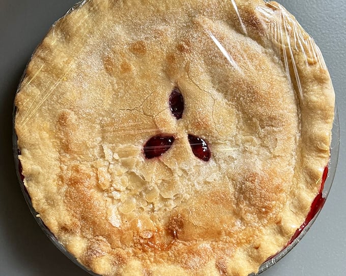 This golden-topped cherry pie isn't trying to win a beauty contest – it's aiming straight for your childhood memories and hitting the bullseye. 