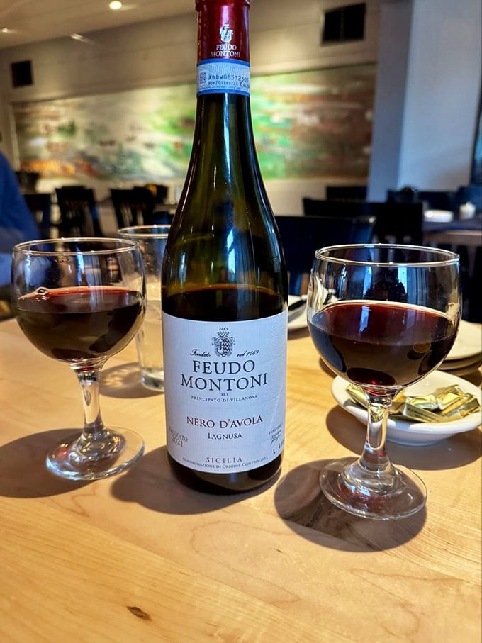 Sicilian Nero d'Avola shared between friends—because nothing says "I value our friendship" like splitting a bottle of robust red with your prime rib.