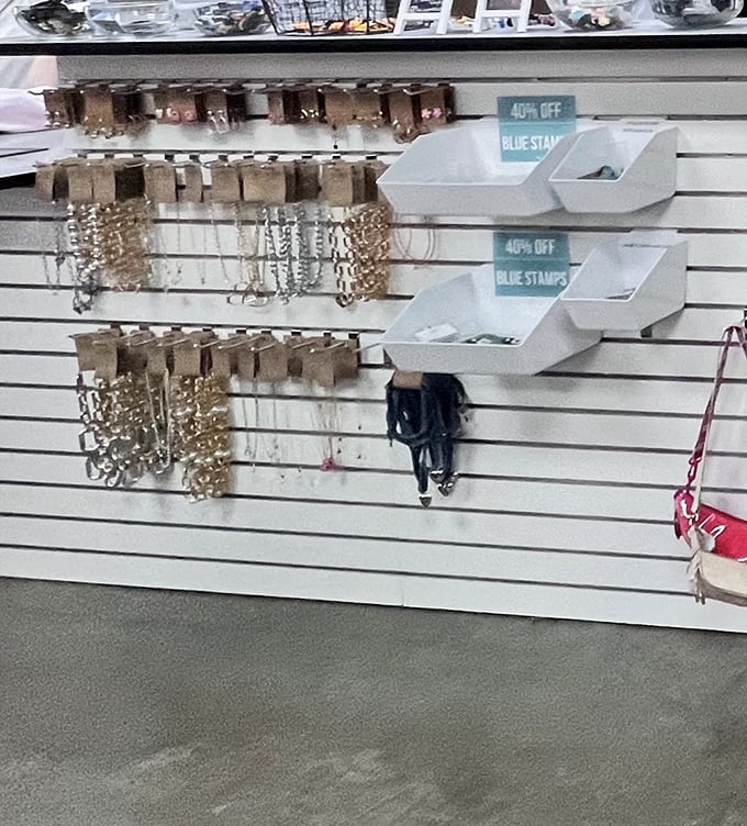 The accessories wall – where scarves and jewelry wait patiently to transform your "meh" outfit into "where did you get that?!"