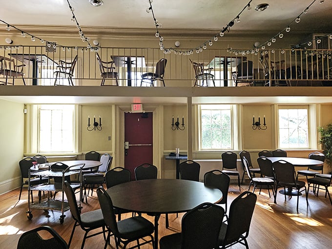 The upstairs dining area offers a bird's-eye view of culinary happiness. Like being sent to the principal's office, but for something deliciously right.