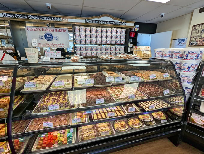 The bakery's display case: a museum of edible masterpieces where you'll want to touch, photograph, and ultimately devour every exhibit.