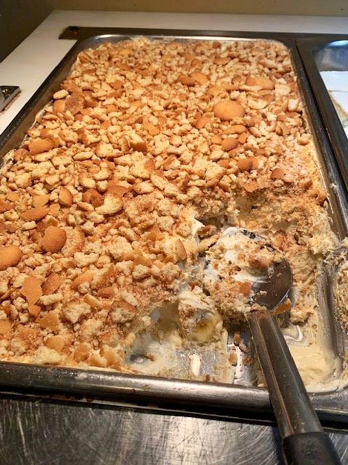 Behold the legendary banana pudding—where vanilla wafers go to fulfill their destiny in a creamy, dreamy afterlife worth every calorie.
