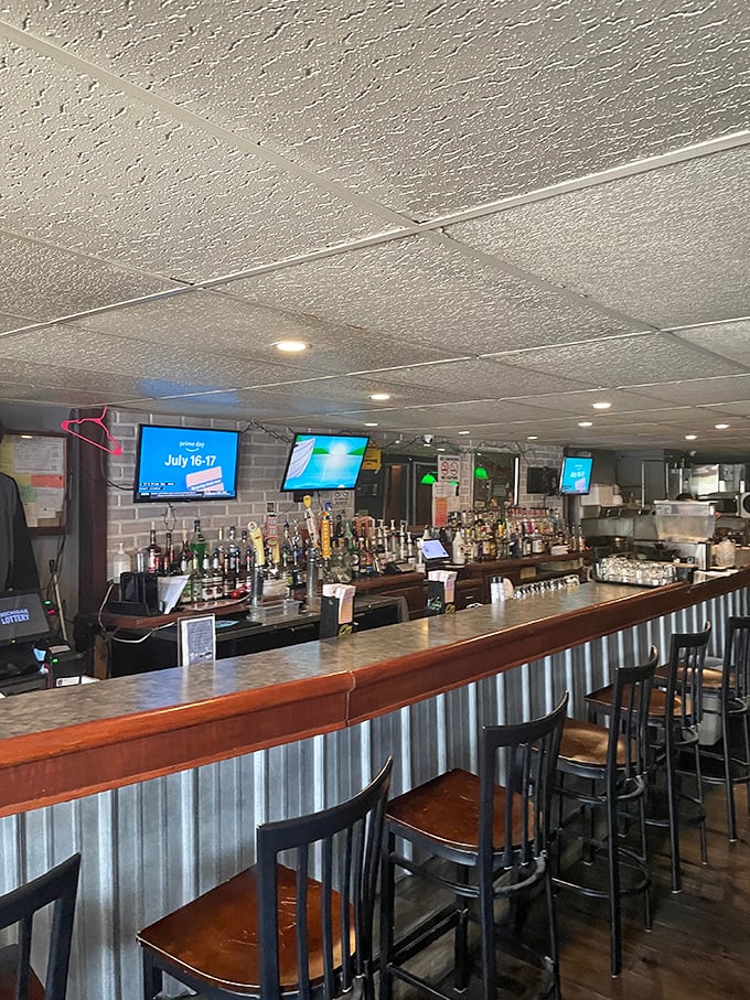 A well-stocked bar with corrugated metal accents strikes that perfect balance between rustic charm and "yes, we can make that cocktail."