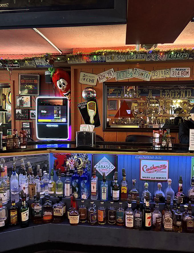 The bar at Grumpy's isn't just stocked – it's a liquid library of possibilities with license plates that tell stories of road trips past.