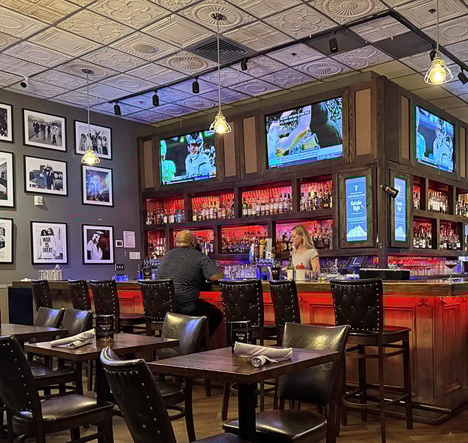 The bar at Cowbell isn't just where drinks are served—it's command central for whiskey exploration and burger anticipation.