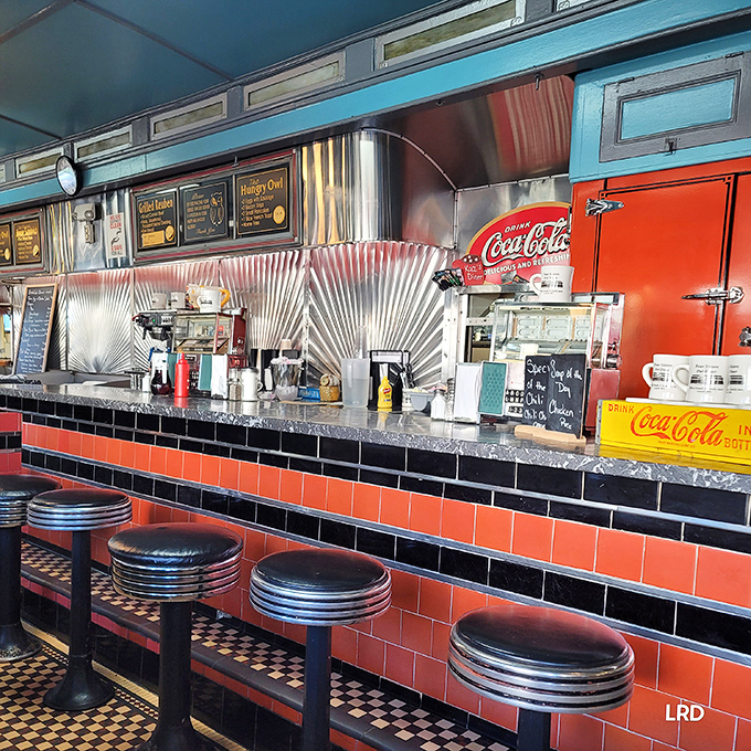 Counter culture at its finest – those classic stools, stainless steel backsplash, and vintage Coca-Cola fridge create the diner trifecta of nostalgia.