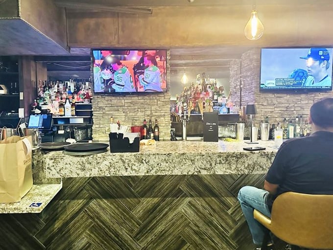 The bar area strikes that perfect balance between sports-watching casual and date-night worthy, with an impressive spirits selection standing at attention.