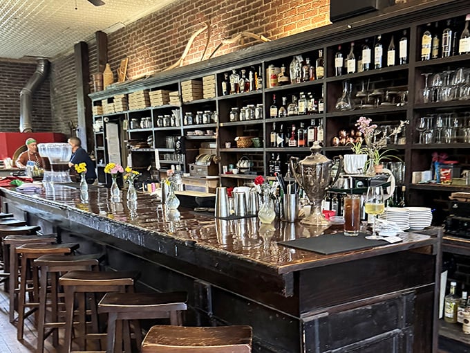 The bar beckons with promises of local brews and conversations that solve all the world's problems by closing time.