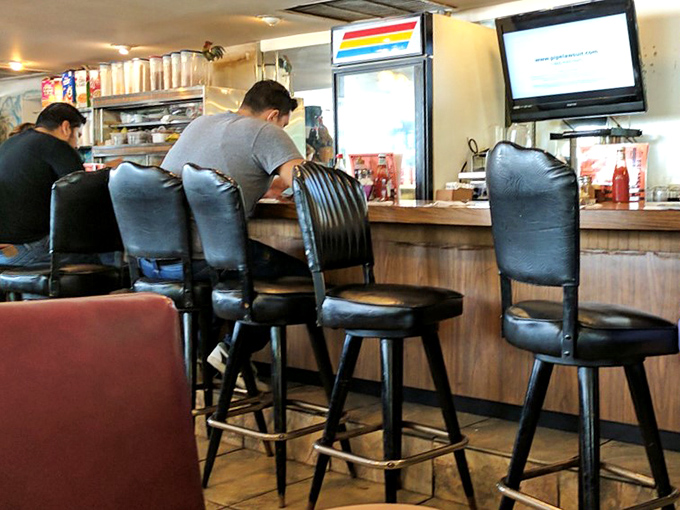 Counter seating – where solo diners become temporary members of the breakfast club and coffee refills arrive before you realize you need one.