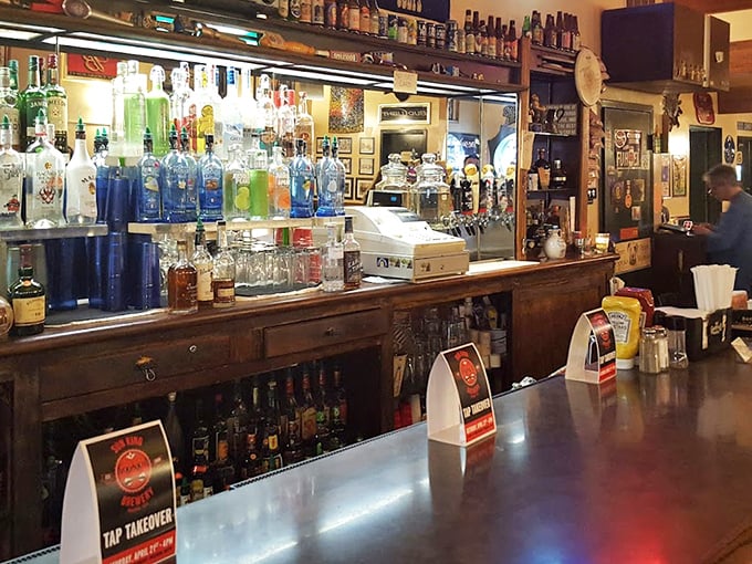 The bar at Mimi's isn't trying to reinvent mixology—it's perfecting the art of pouring exactly what you want in an atmosphere where everybody might not know your name yet, but they will soon.