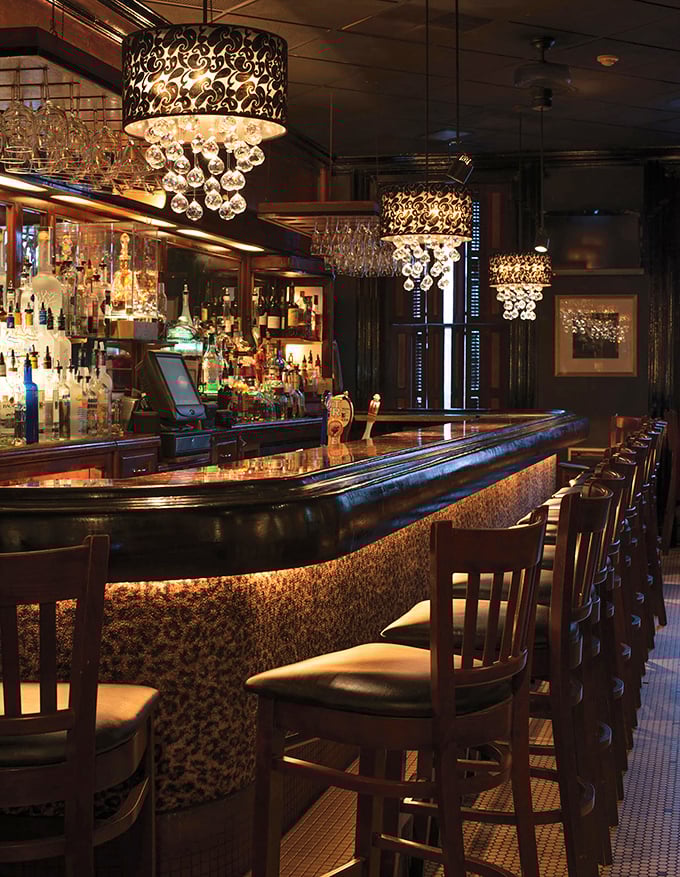 A bar that whispers "stay awhile" under crystal chandeliers. Where cocktails are crafted with the precision of Swiss watchmakers.