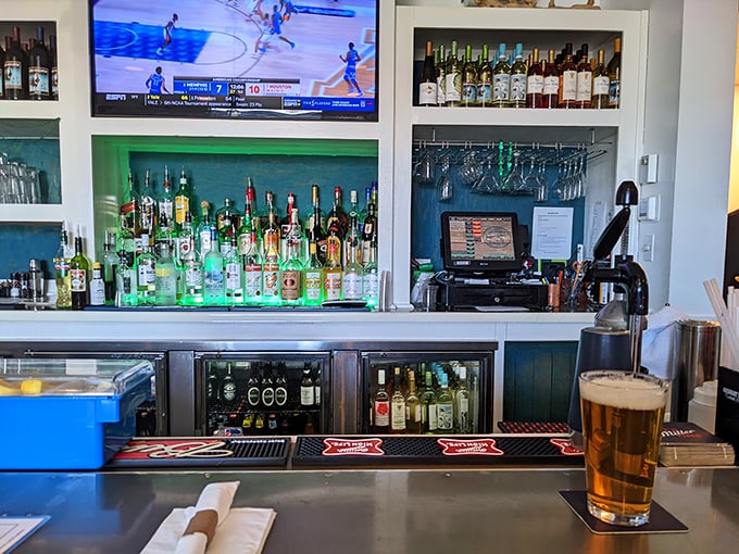 The well-stocked bar isn't just serving drinks—it's fueling vacation stories that begin with "Remember that time at Waterman's when..."