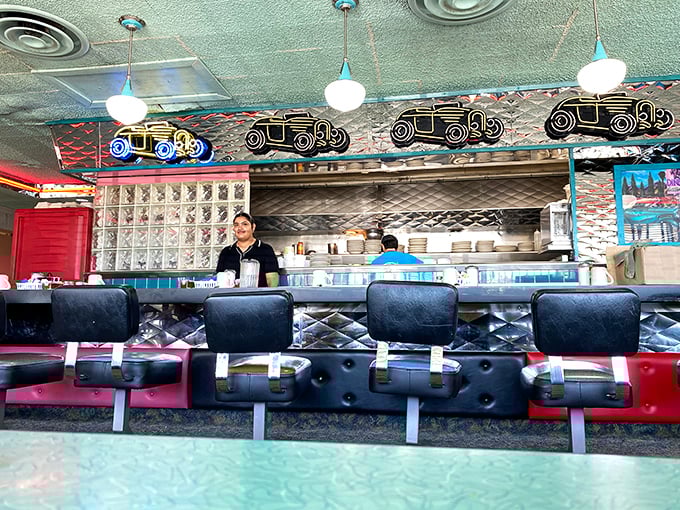 The counter where breakfast dreams come true. Those vintage car decorations aren't just nostalgia – they're promising to drive your taste buds to flavor town.