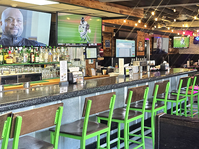 The bar area glows with possibility—where sports on TV and pizza on plates create the perfect formula for contentment.