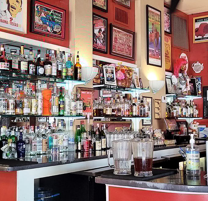 The bar isn't just stocked, it's curated – a liquid library of spirits where the bartenders know the difference between mixing a drink and crafting an experience.