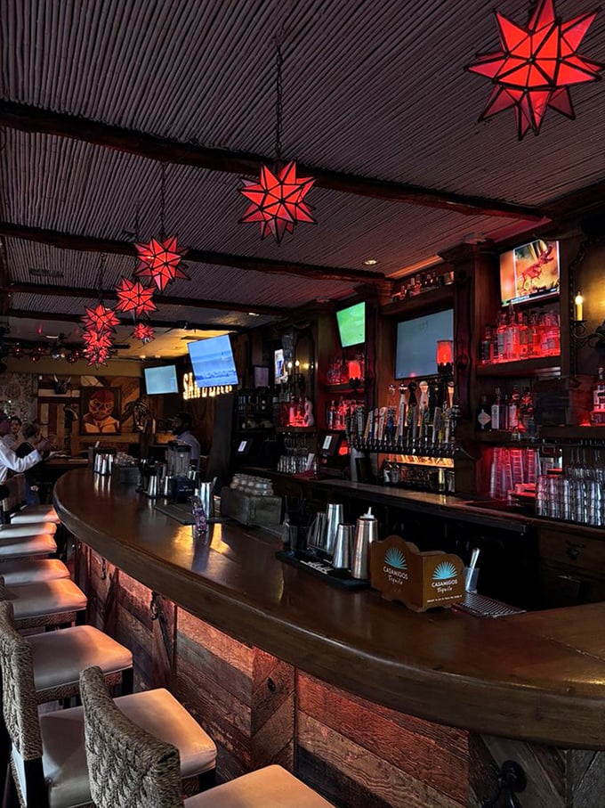 The star-shaped lanterns cast a warm red glow over the bar, creating an atmosphere where even ordering water feels like an exotic adventure.